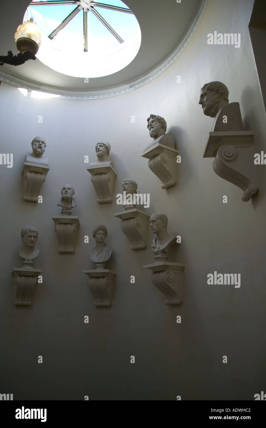 Busts on a wall Stock Photo - Alamy