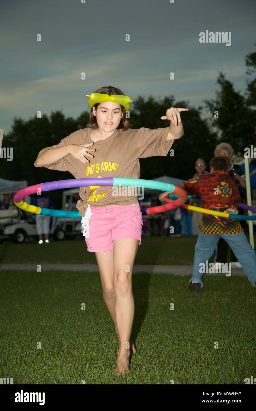 Young teenage girl competes in hoola hoop contest at American Cancer ...