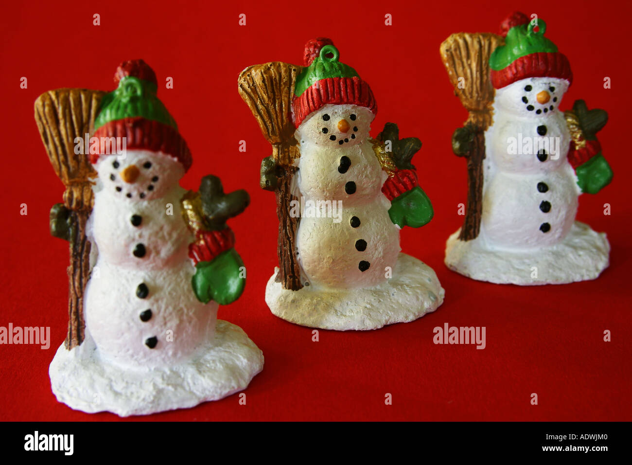 Three snowman figures Stock Photo - Alamy