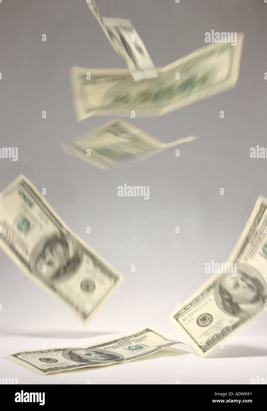 One hundred dollar bills falling down from the sky Stock Photo - Alamy