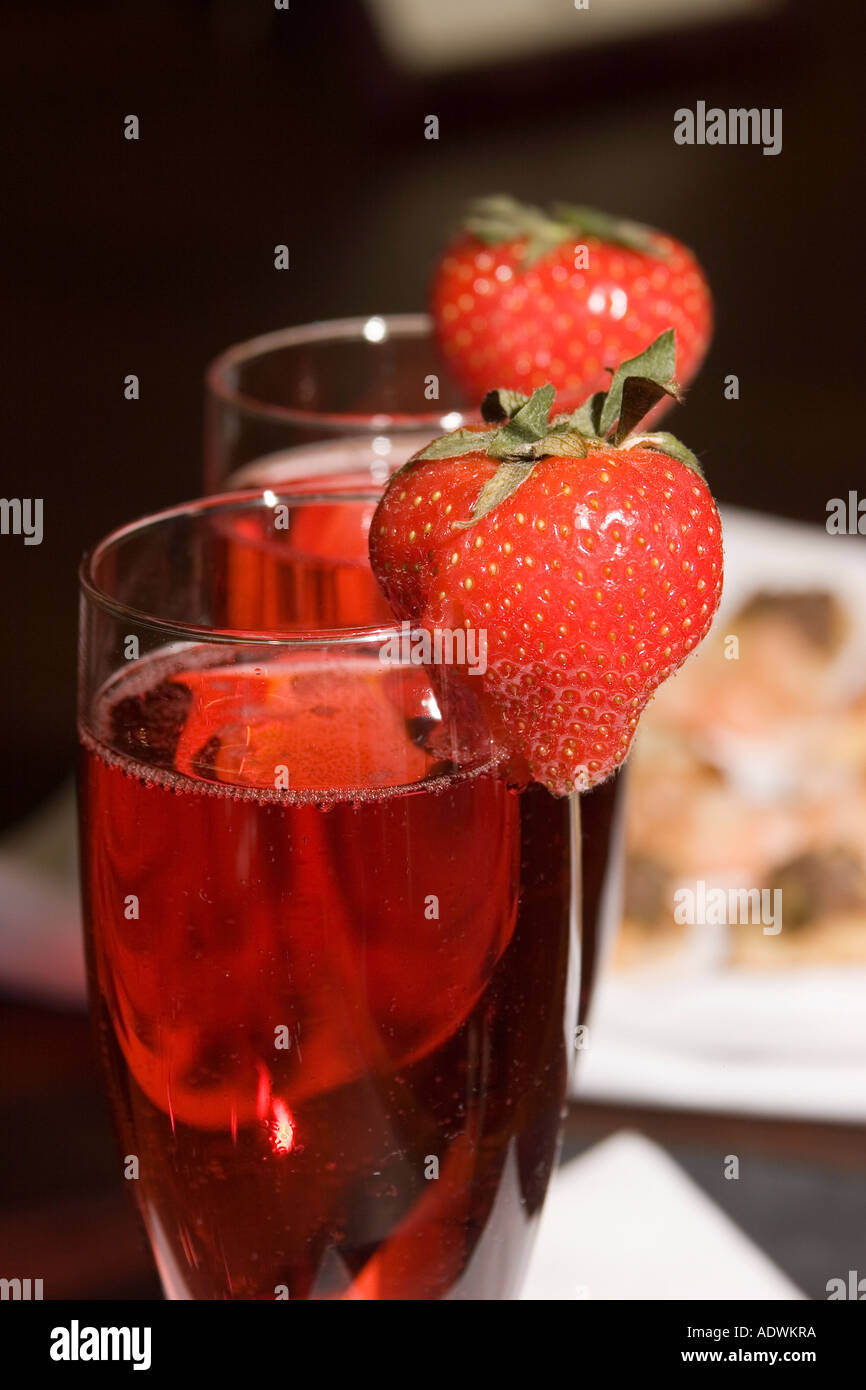 celebration Kir Royale and strawberry in flute glasses Stock Photo - Alamy