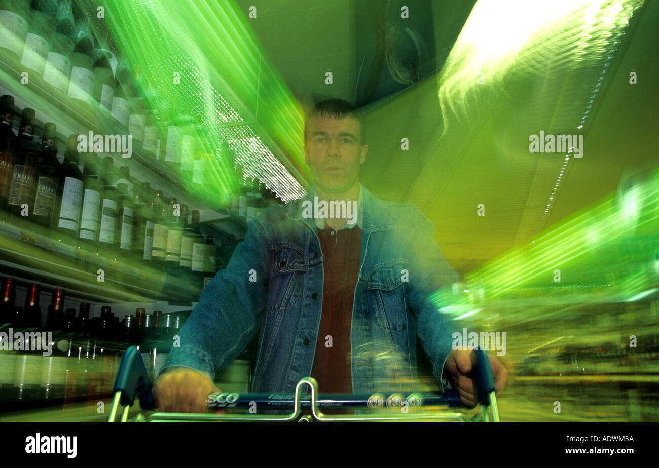 Man dressed casually shopping in Tesco supermarkets wine beer off ...