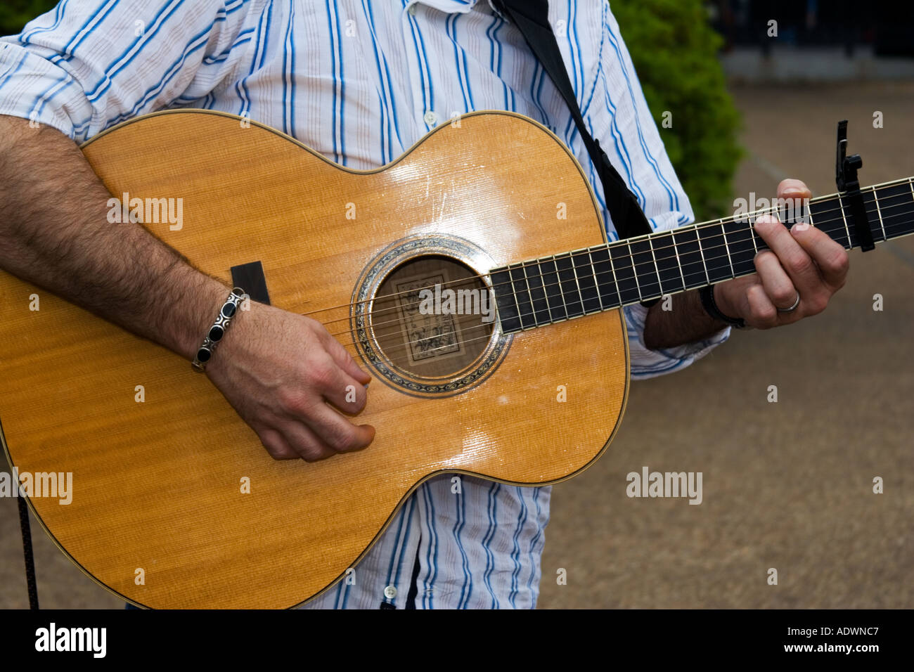 A guitar being played Stock Photo - Alamy