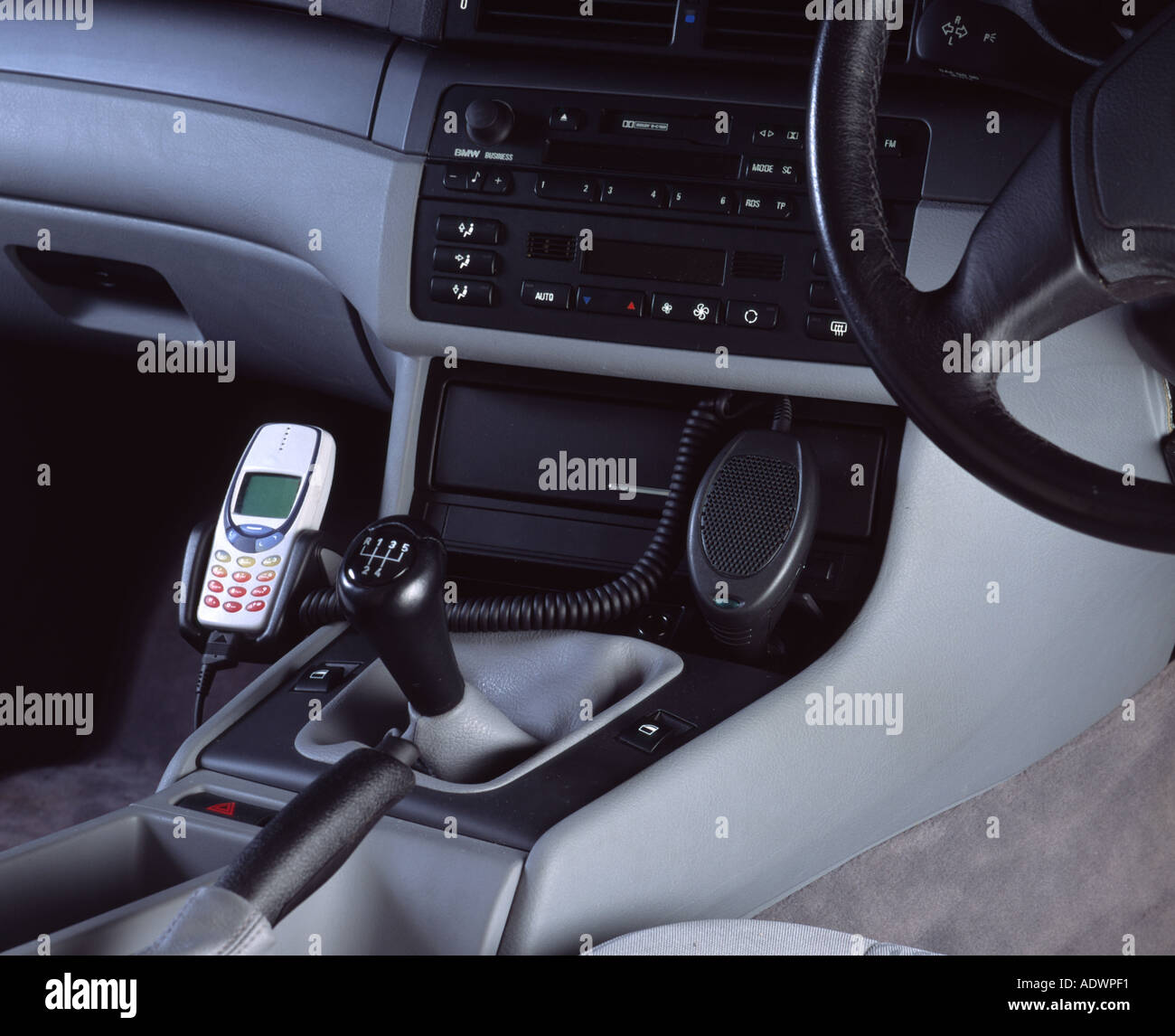 mobile phone fixed to the interior of a car dashboard Stock Photo - Alamy