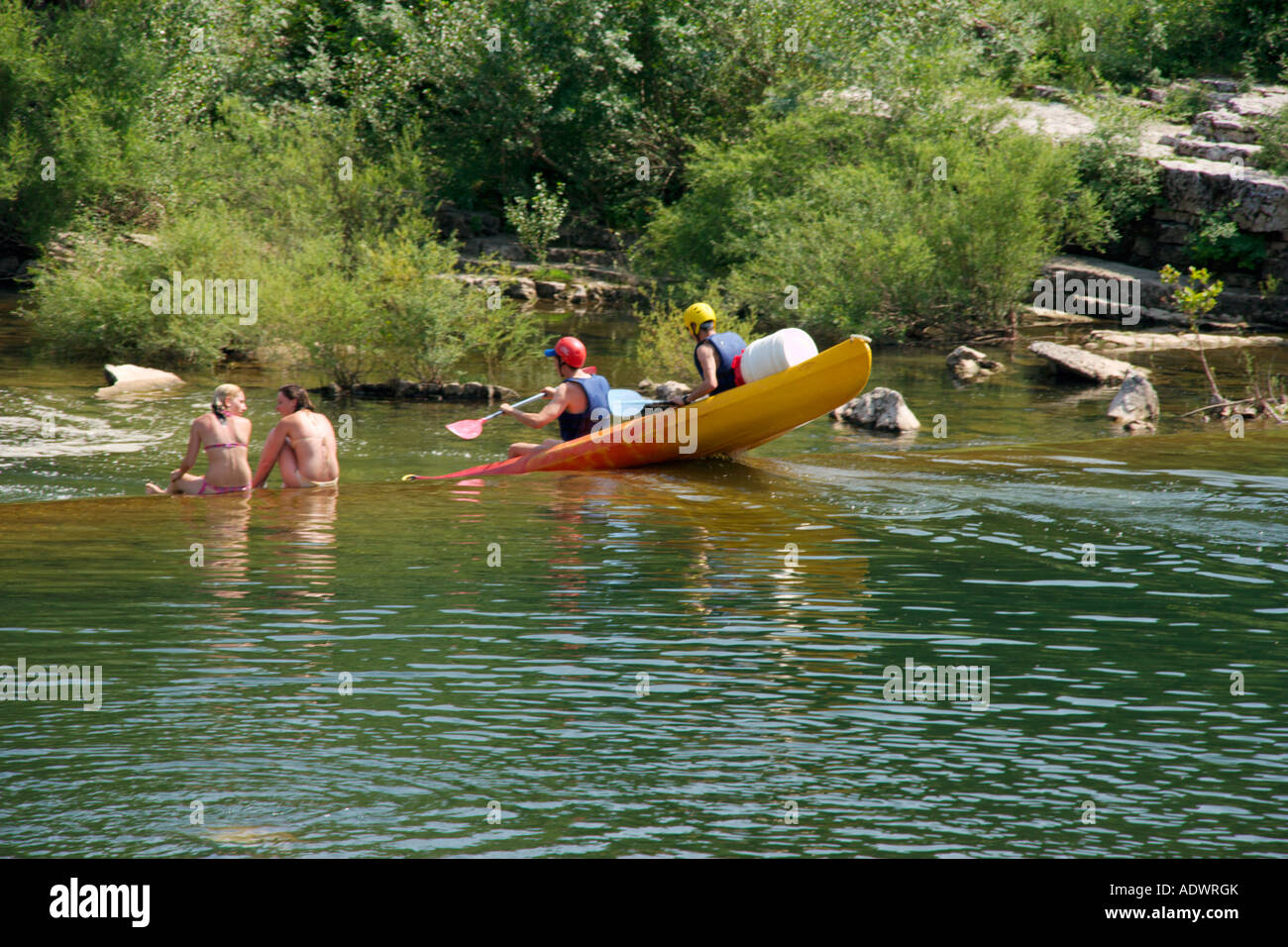 Tourists canoeing on the l’herault river, Languedoc Roussillon. The ...