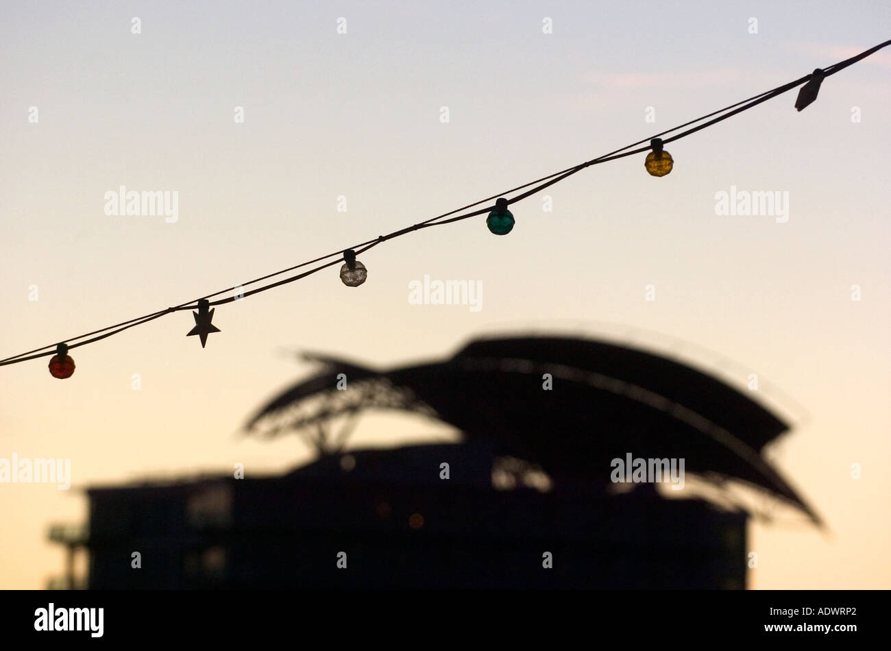 Christmas lights in Cardiff Bay at sunset with the St Davids Hotel in ...
