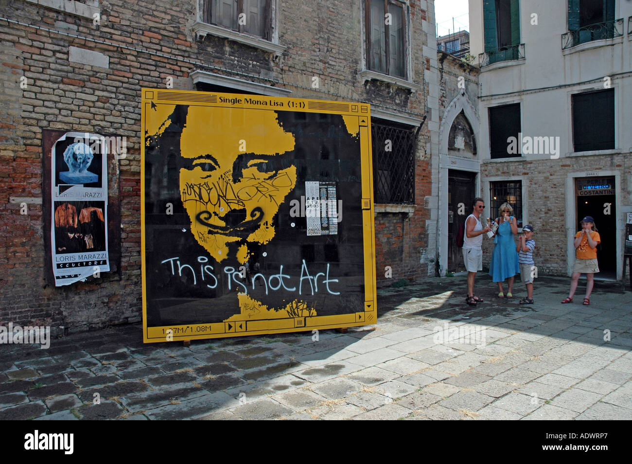 Defaced Mona Lisa poster in Venice Stock Photo - Alamy