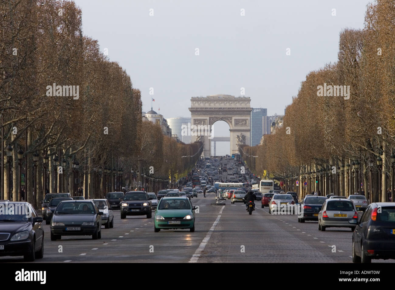 Traffic travelling on Champs Elysees by Arc de Triomphe Central Paris ...