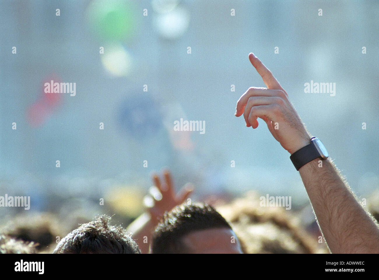 A Guy Pointing At A Crowd