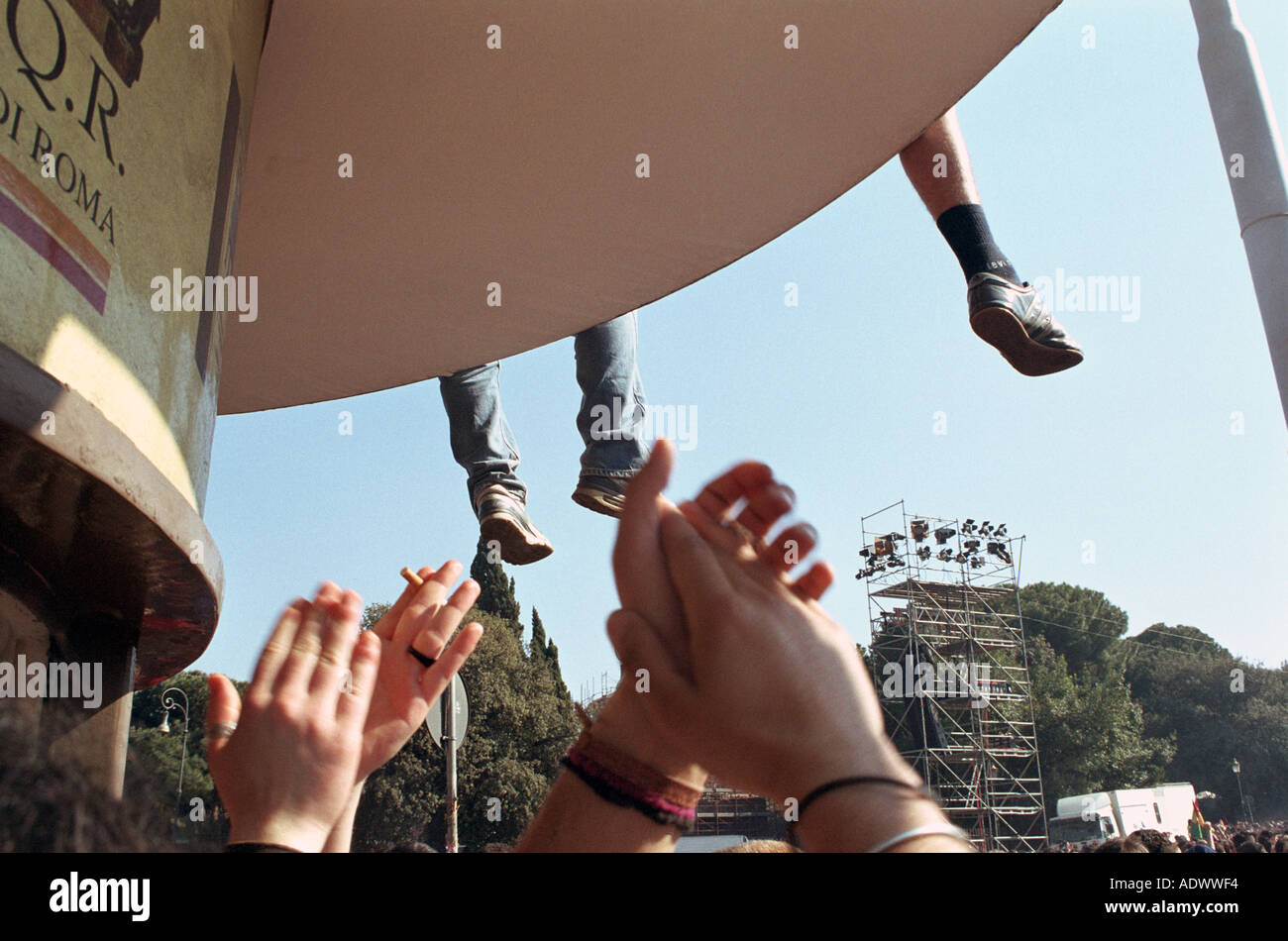 view of three feet and crowd from below watching concert Stock Photo ...