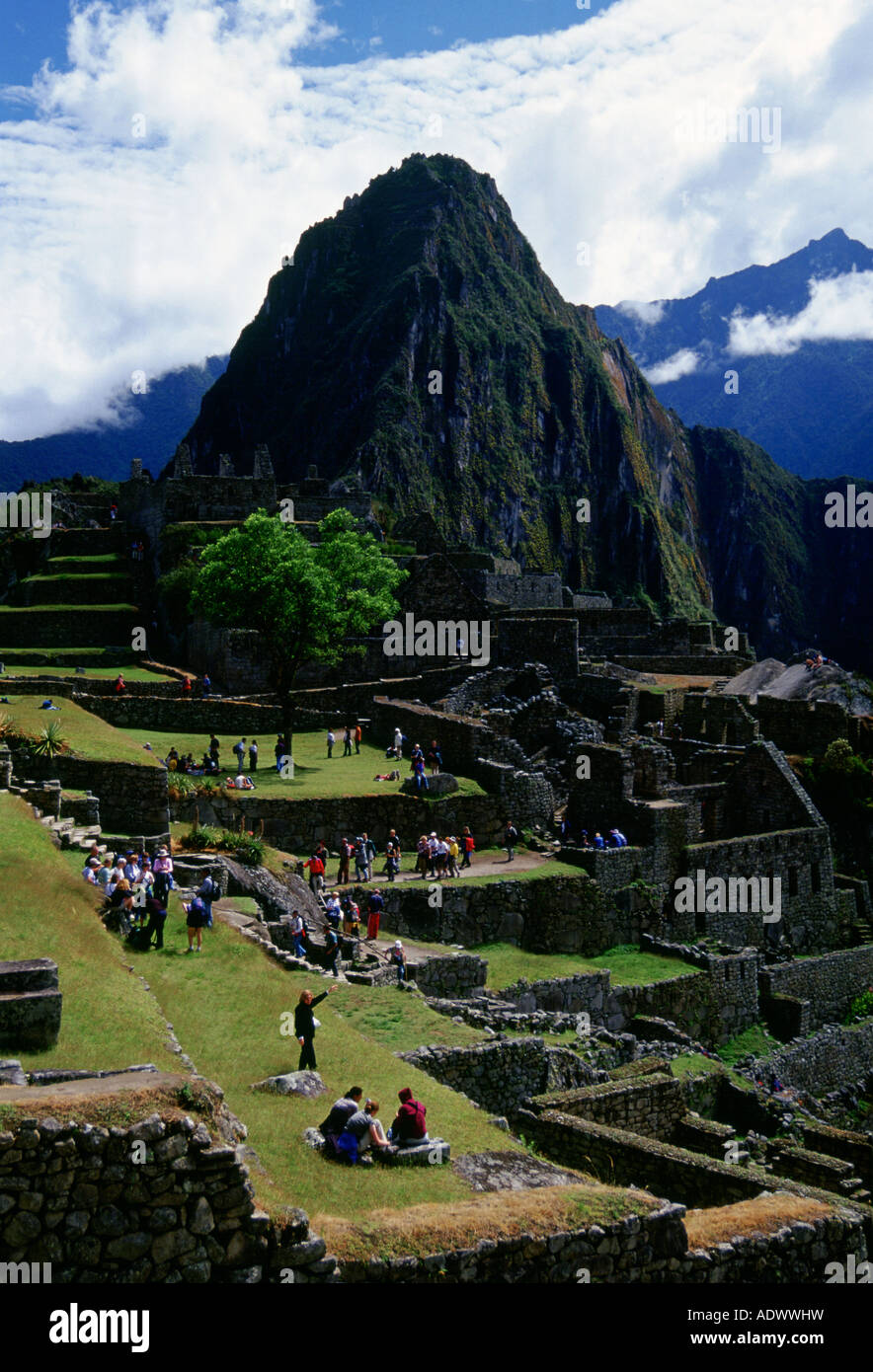 Tourists visit Machu Picchu ruins of Inca citadel old city in Peru ...