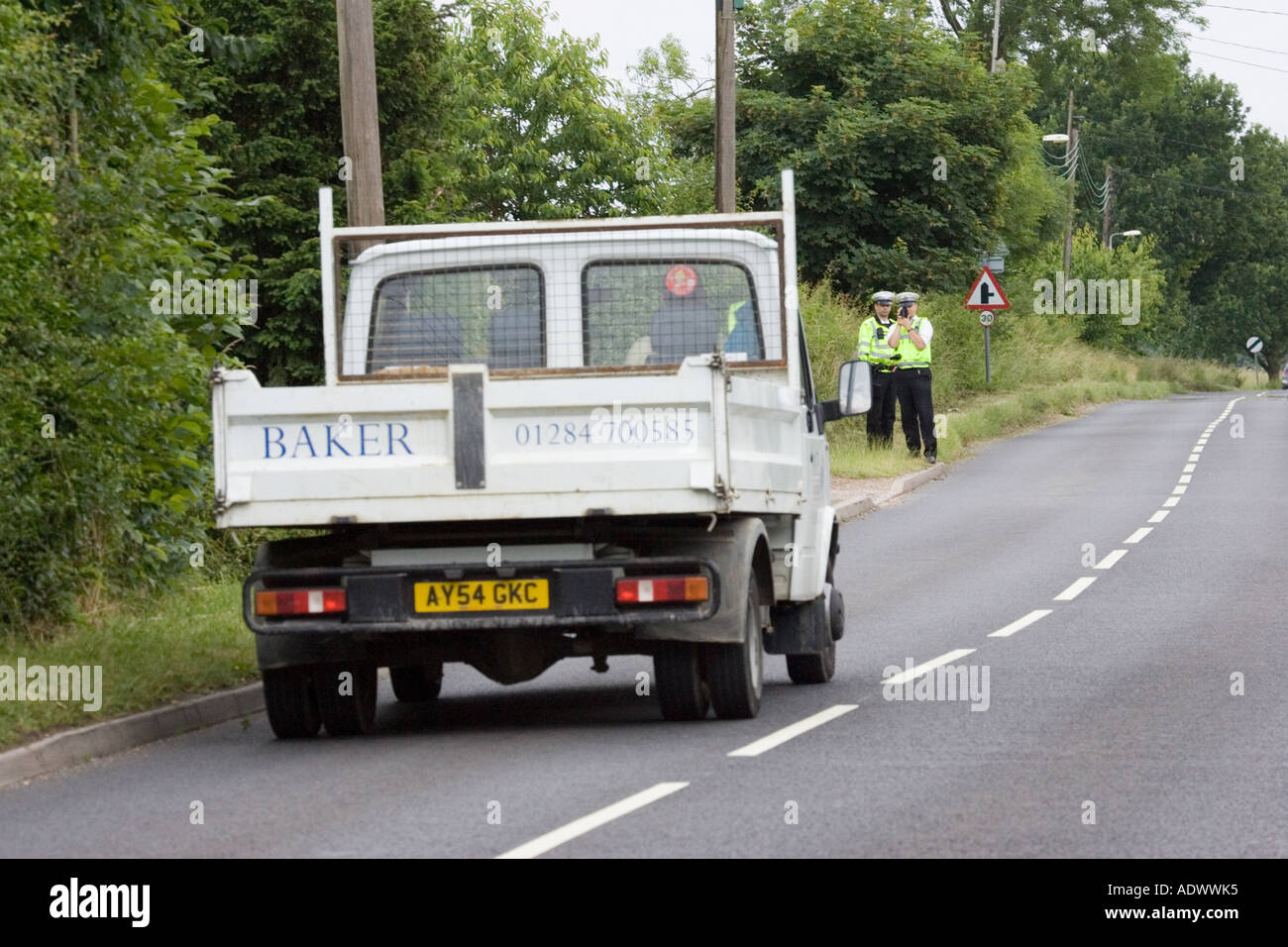 Police officers with a hand held laser speed camera detector Stock ...