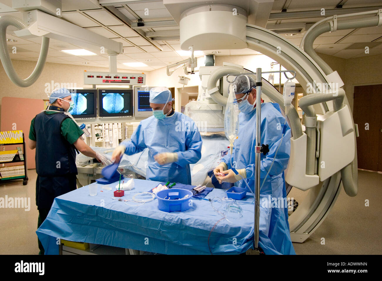 doctors performing angiogram procedure in cardiac cath lab Stock Photo ... doctors performing angiogram procedure in cardiac cath lab Stock Photo ...