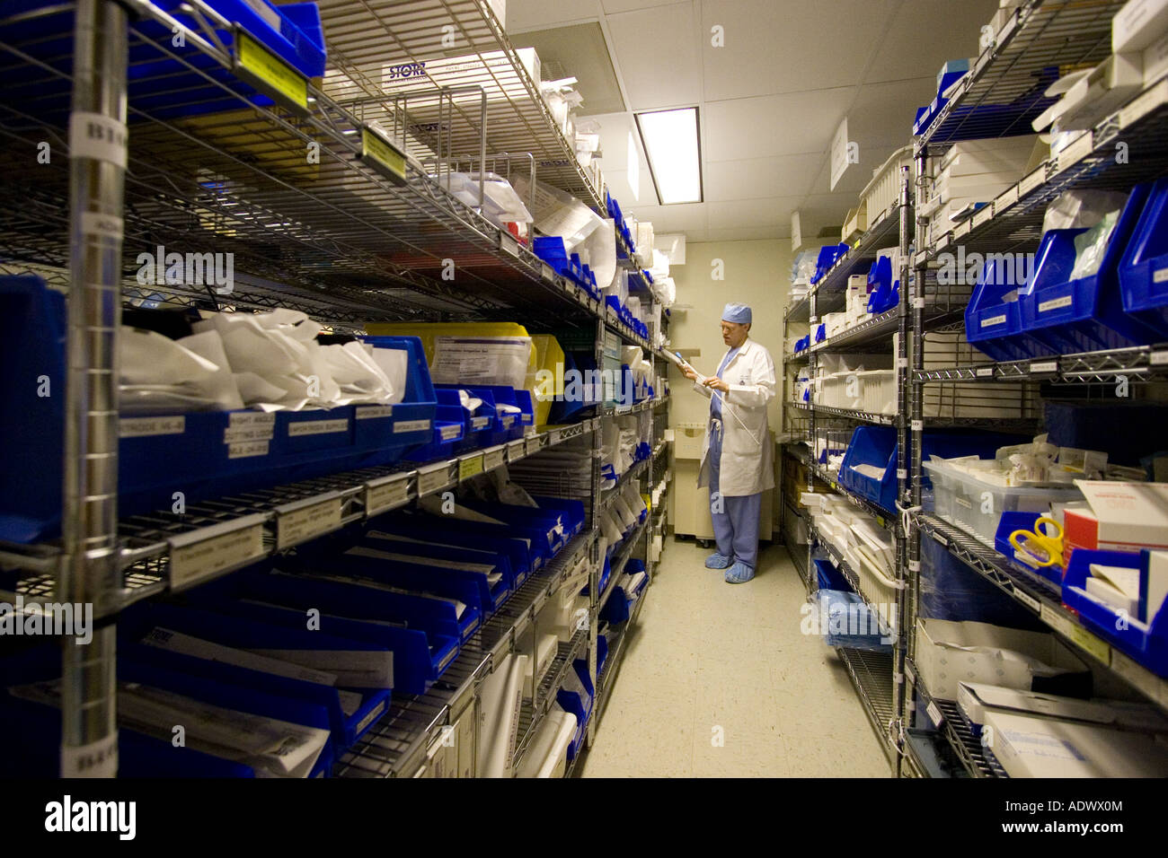 surgeon or physician looks over medical instruments or surgical tools ...