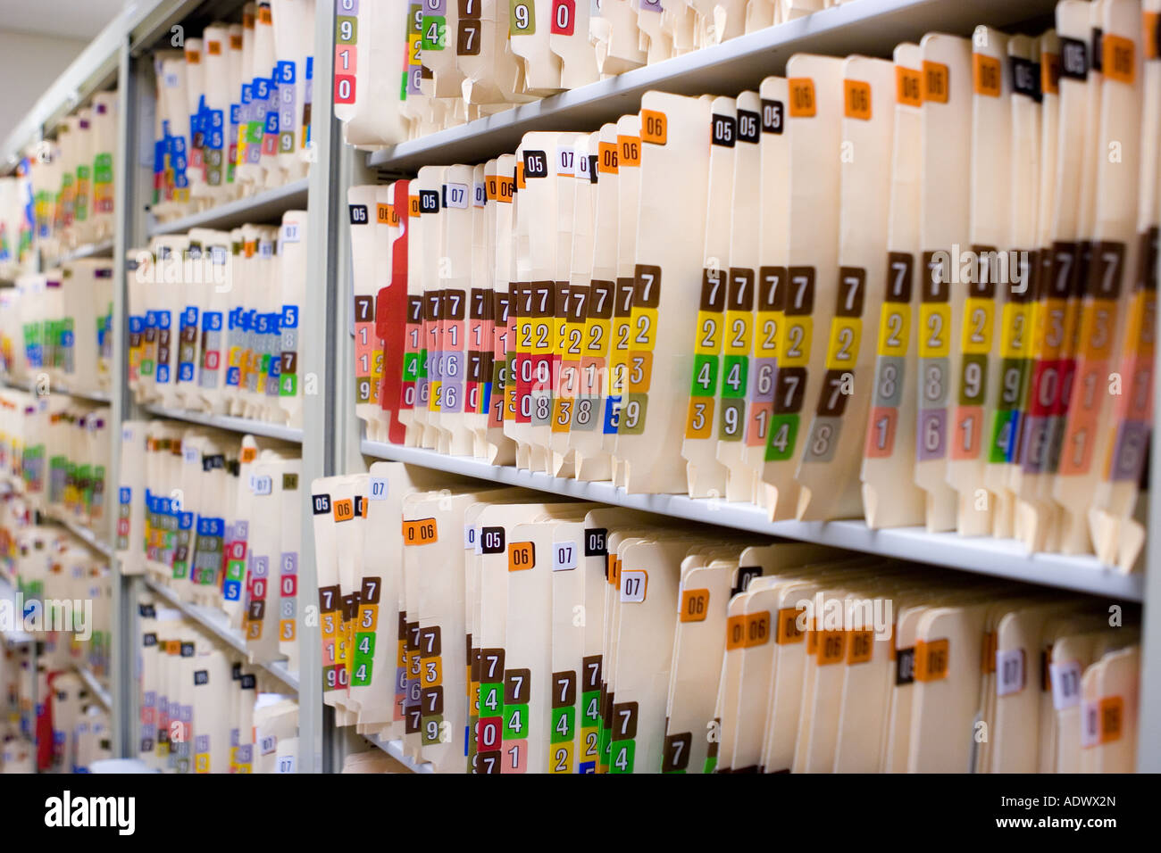 rows of colorfully tabbed medical files charts or records Stock Photo ...