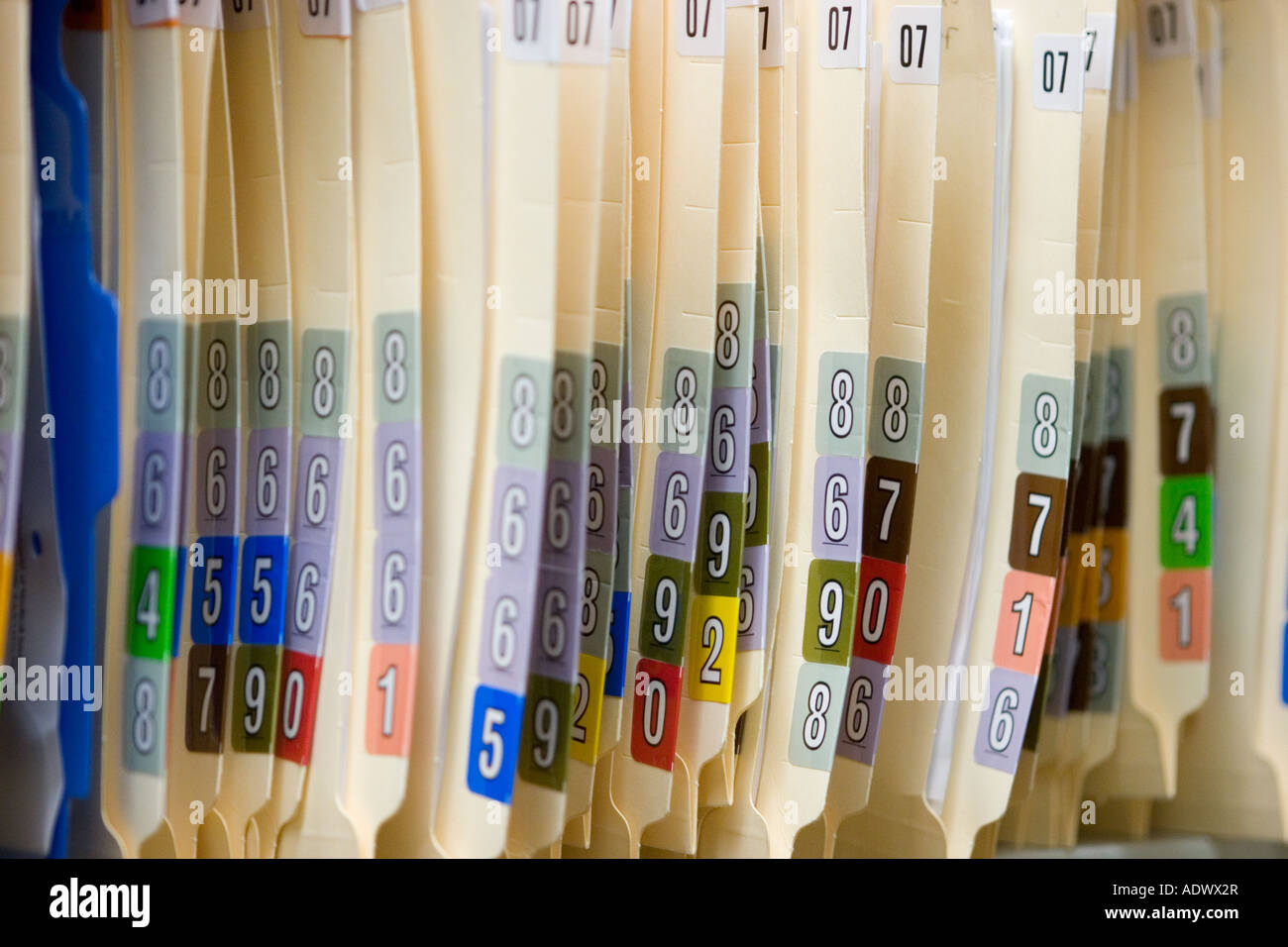 colorfully tabbed medical files charts or records Stock Photo - Alamy