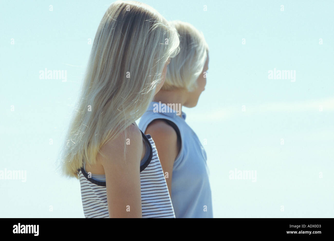 Friends standing side by side, side view Stock Photo - Alamy