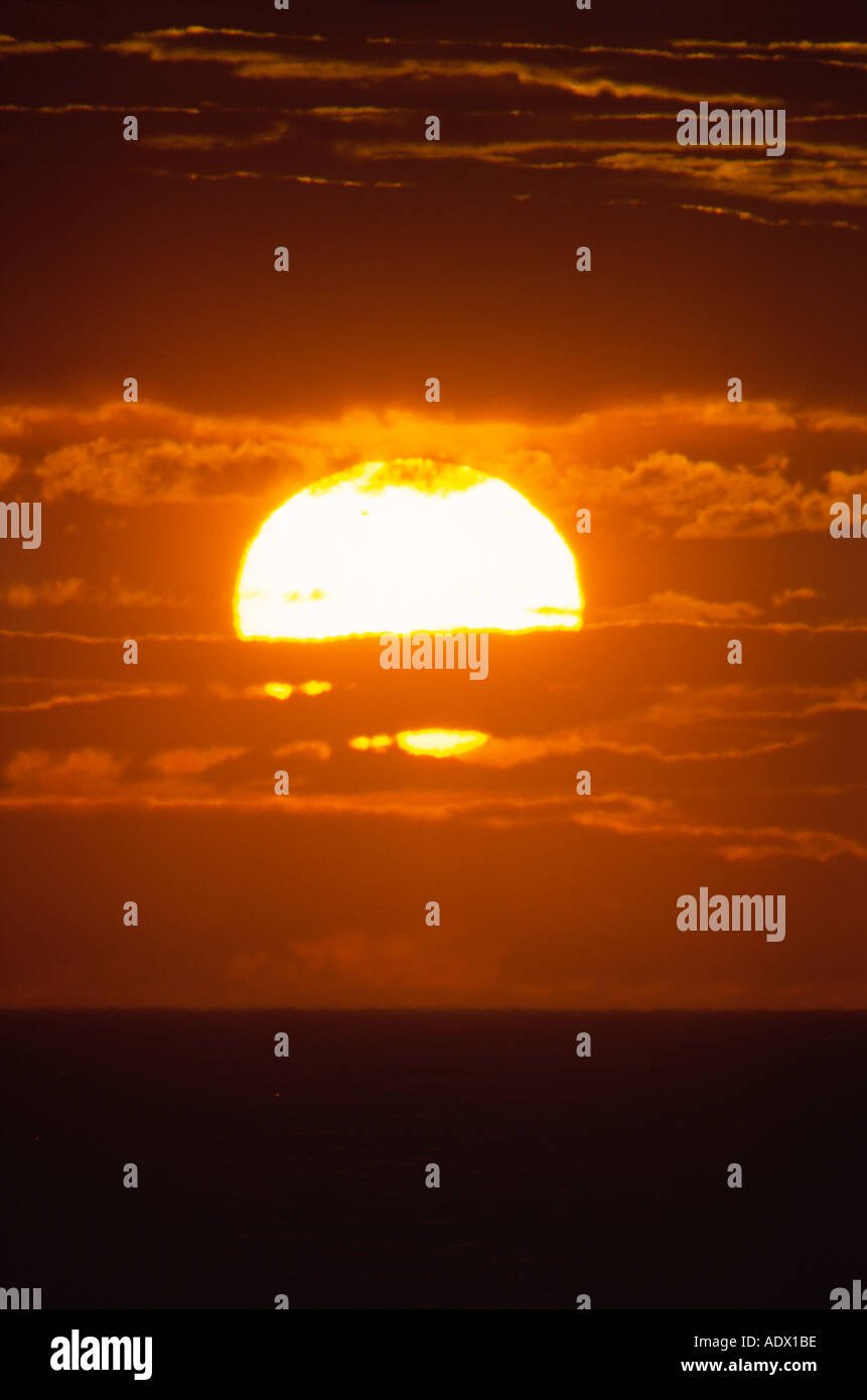 Big sun setting over the sea Stock Photo - Alamy