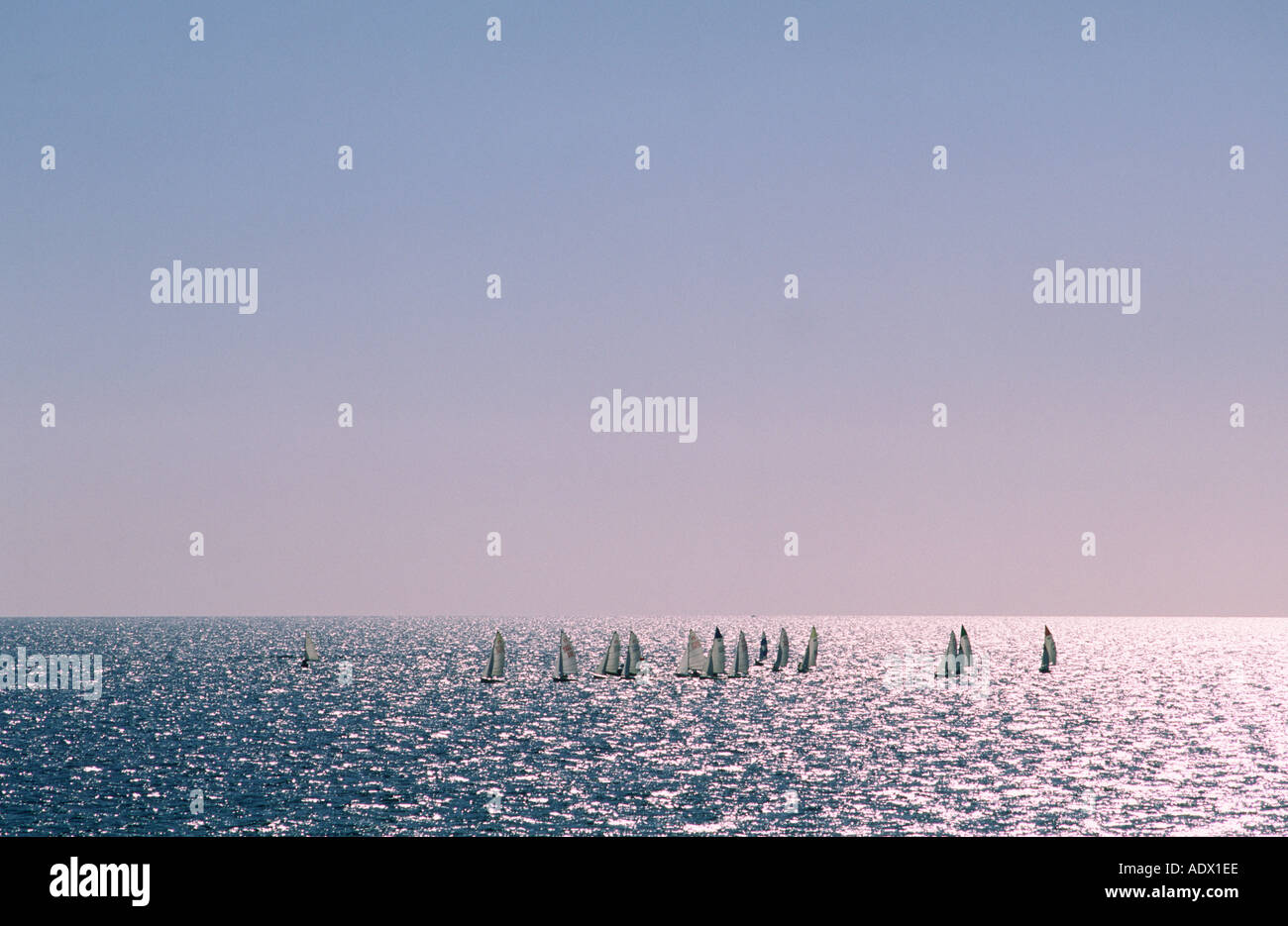 Small sailboats racing at sea Stock Photo - Alamy