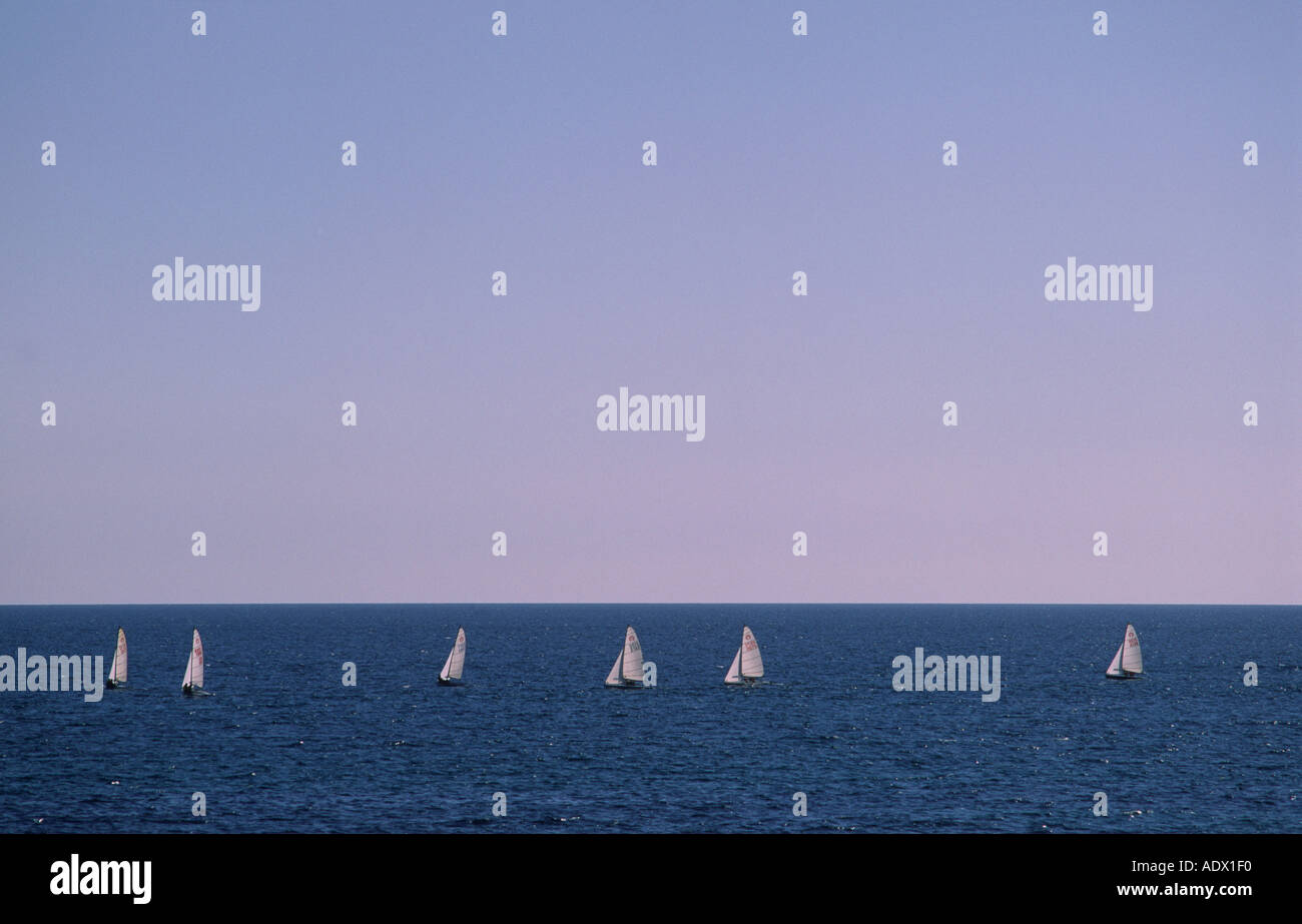 Small sailboats racing at sea Stock Photo - Alamy