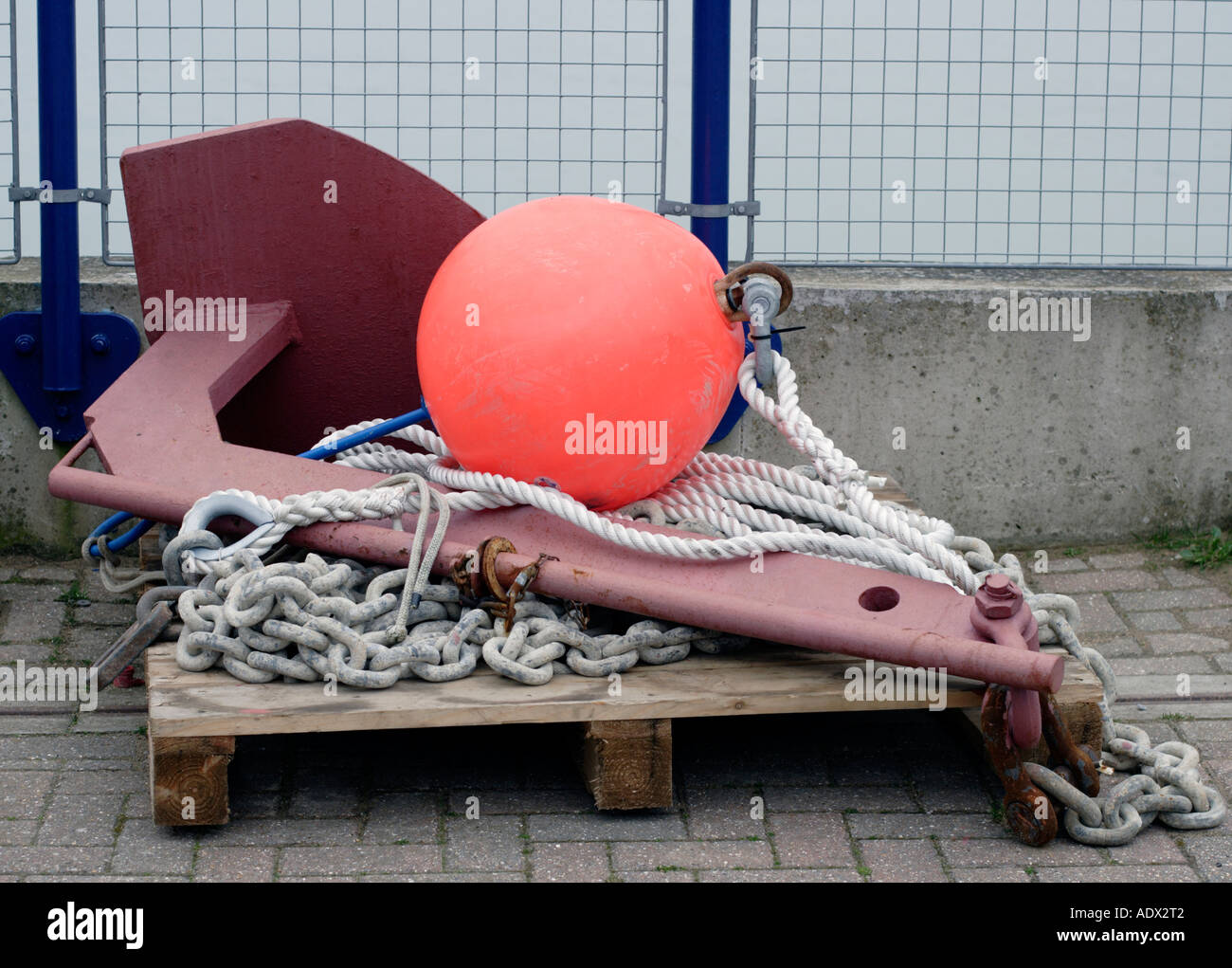 Ships anchor with rope chain and buoy Stock Photo - Alamy