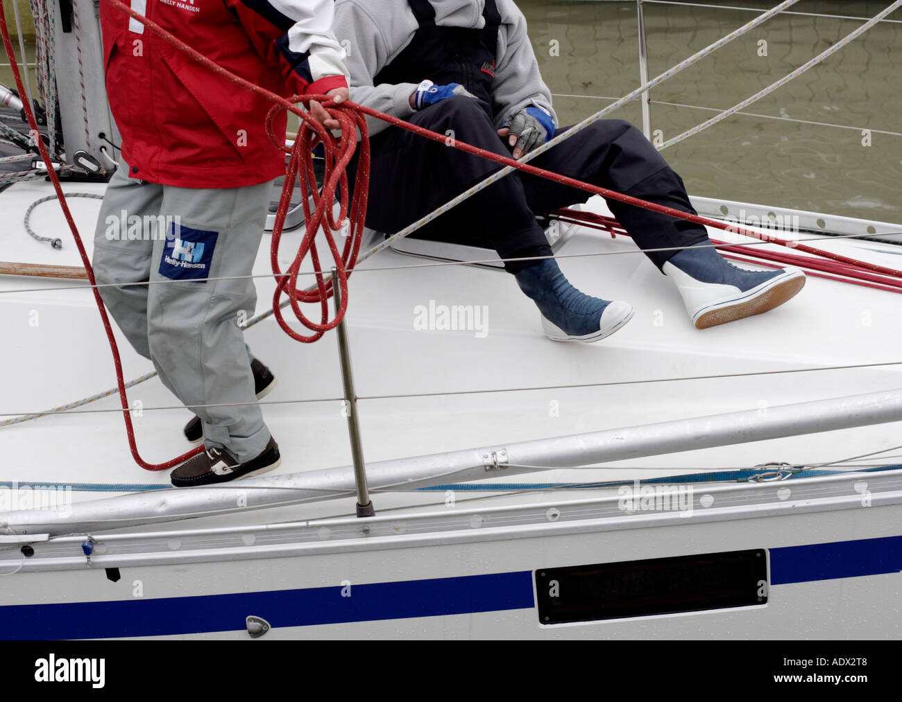 Detail of yaught deck and sailors legs Stock Photo - Alamy