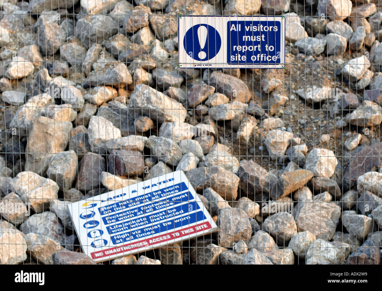 Construction warning signs rock pile Stock Photo - Alamy