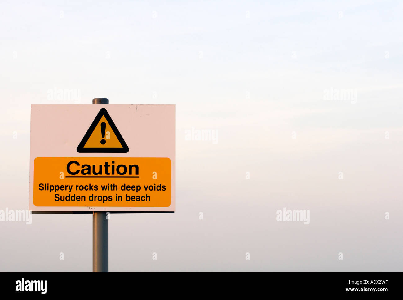 Warning sign on beach Stock Photo - Alamy