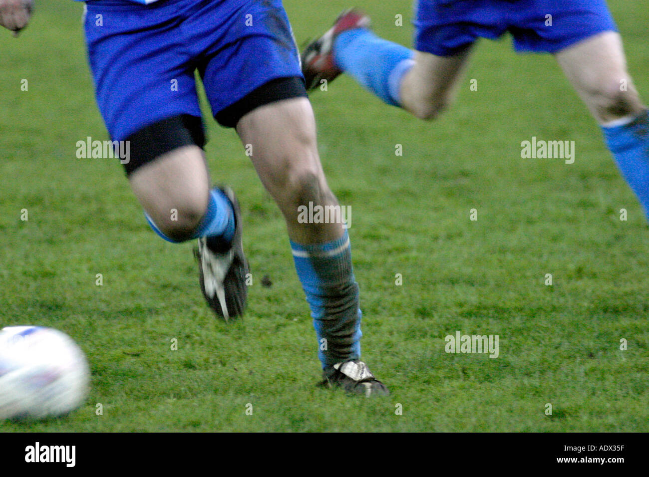 close up of football players legs and ball Stock Photo - Alamy