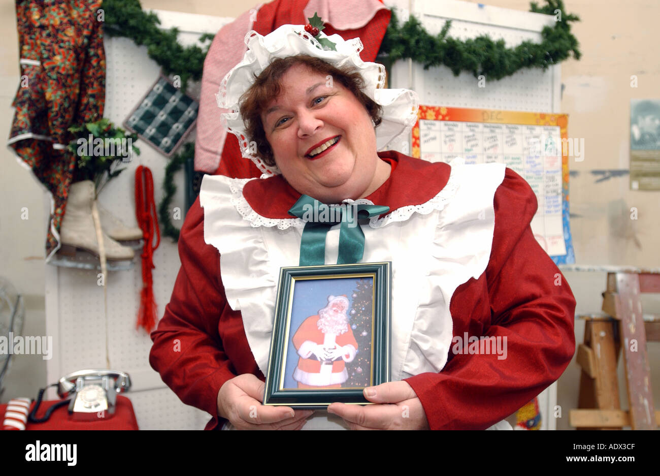 Christmas humor humour Mrs Clause with picture of Santa Stock Photo - Alamy