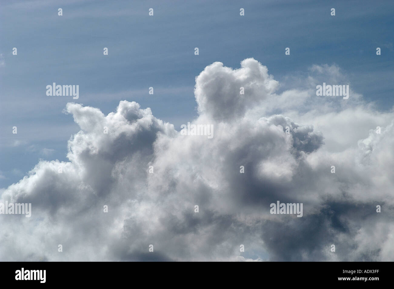 Fluffy clouds across the sky Stock Photo - Alamy