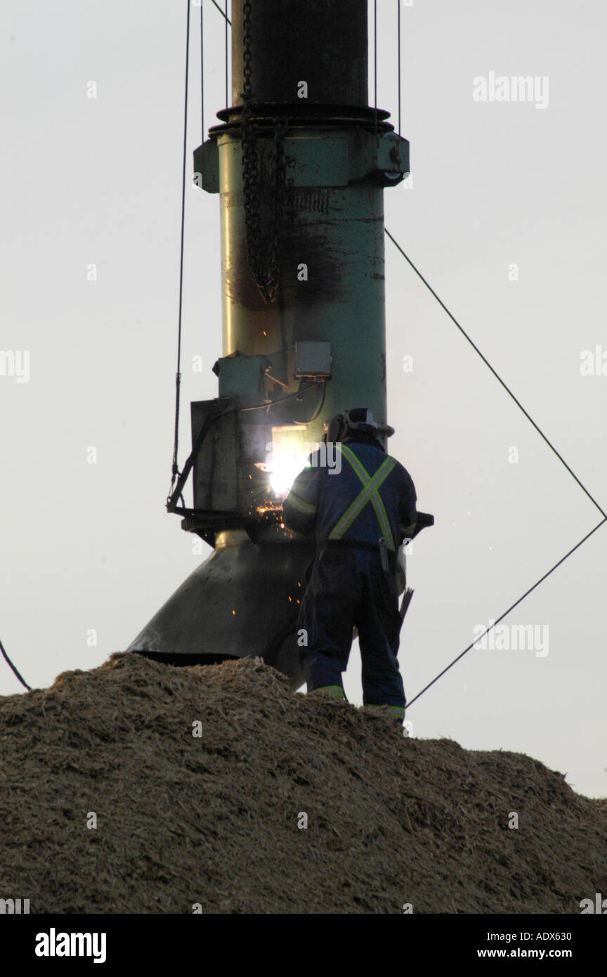 SERVICING THE SAWDUST PIPE Stock Photo - Alamy