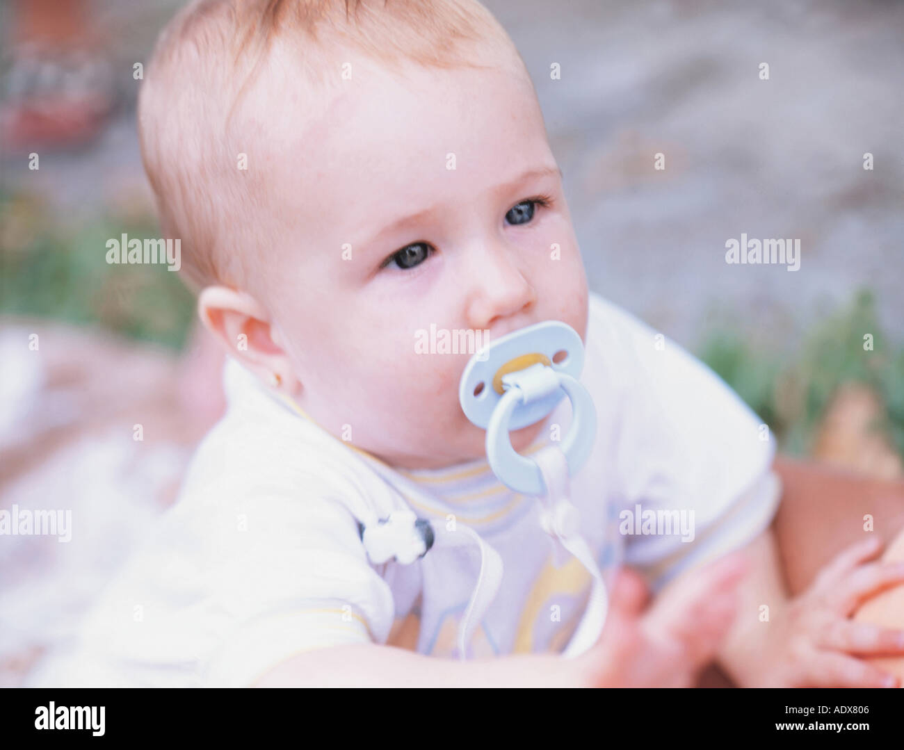 Children pacifier sucker white blonde sitting cute small expressionless ...