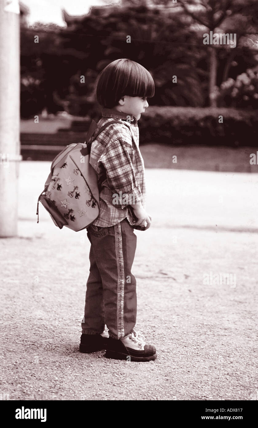 Children little boy backpack profile student waiting school pickup pick ...