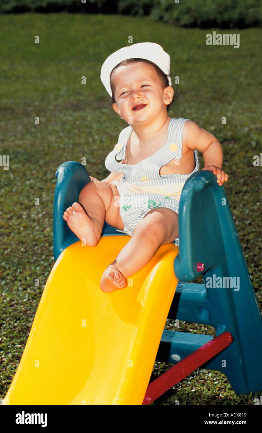 Children ladder little boy overall smiling sitting top grass toddler ...