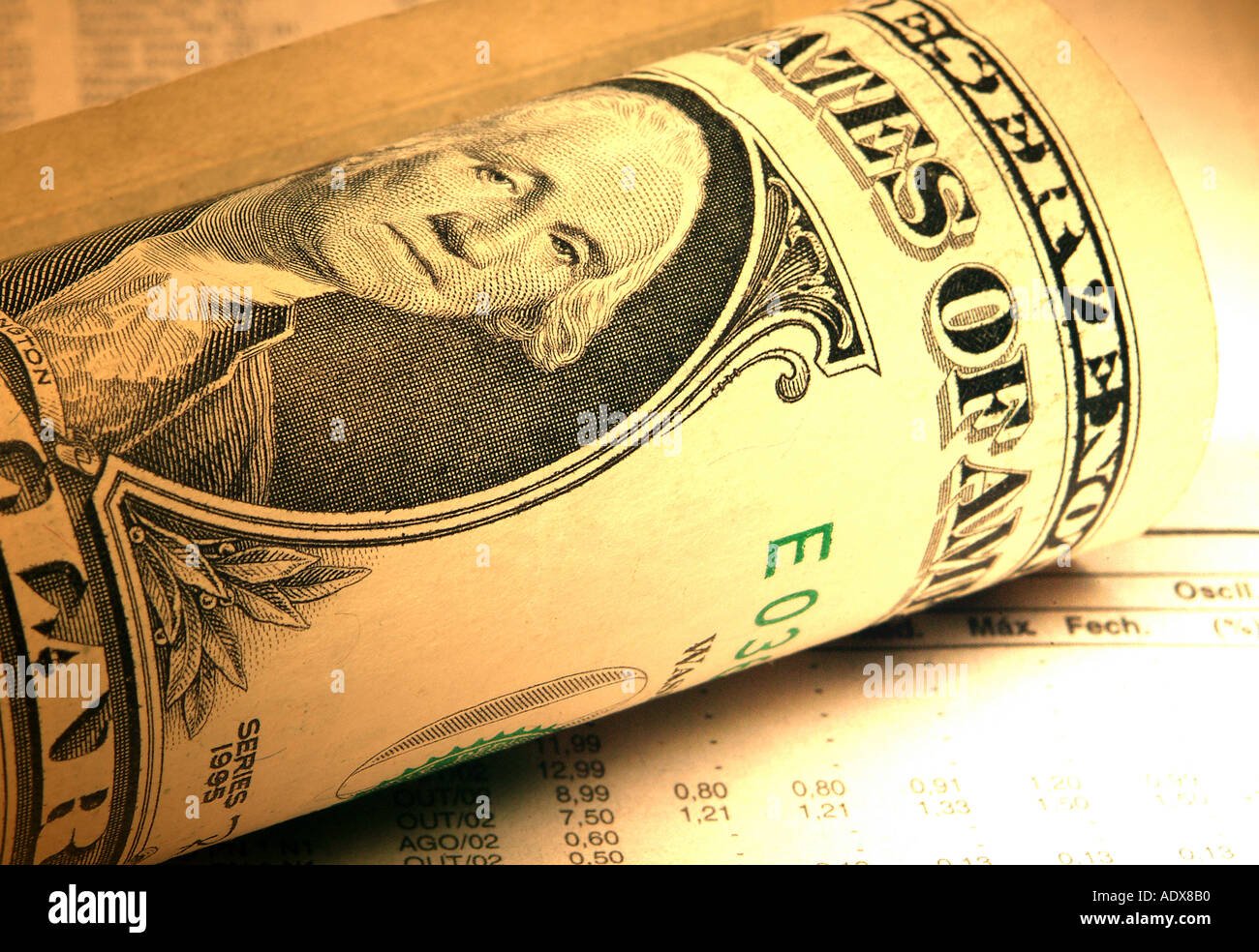 Business Concepts II dollar bill rolled up newspaper pages financial ...