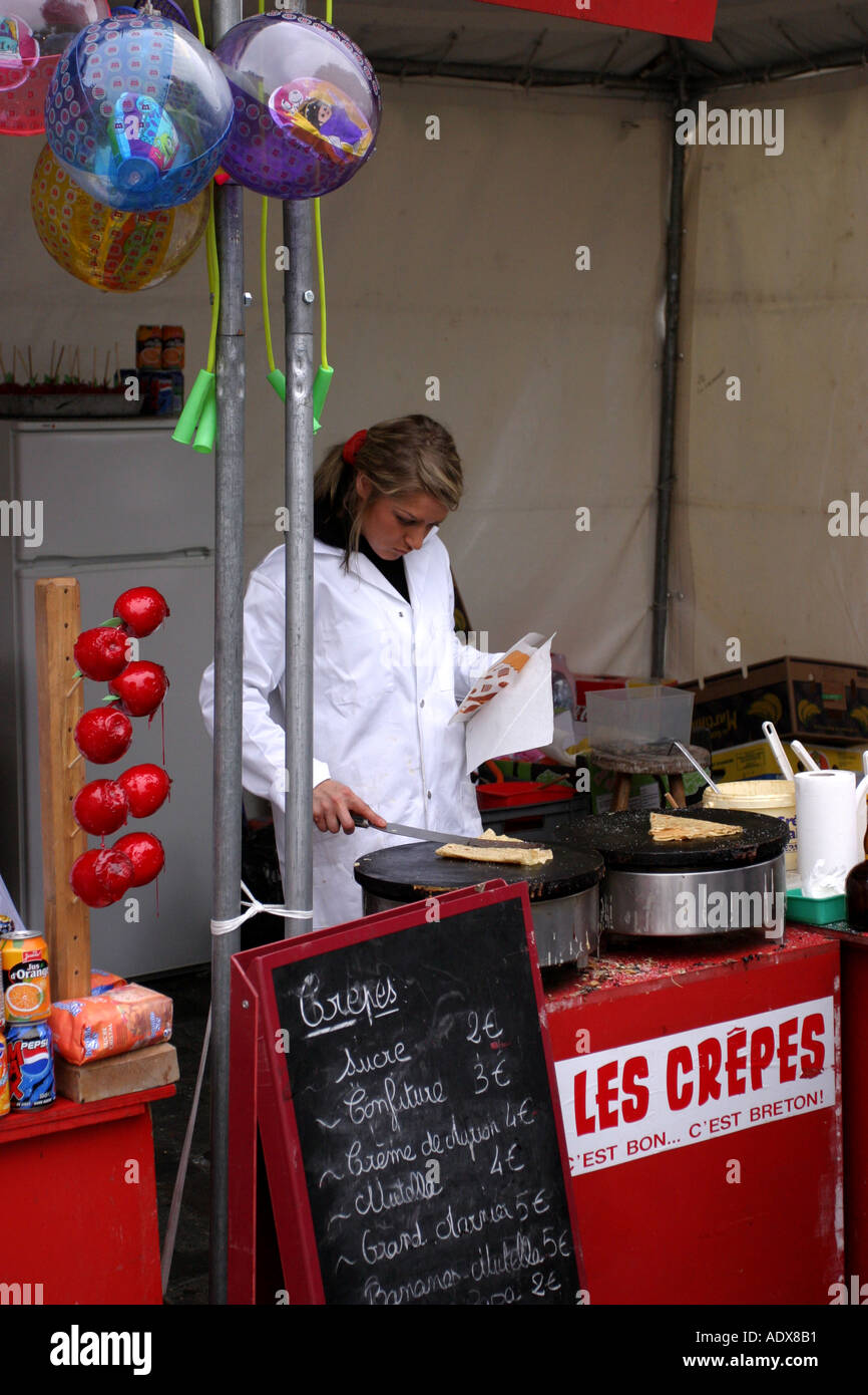 Frenchwoman at outdoor market making crepes in Montmartre Paris France ...