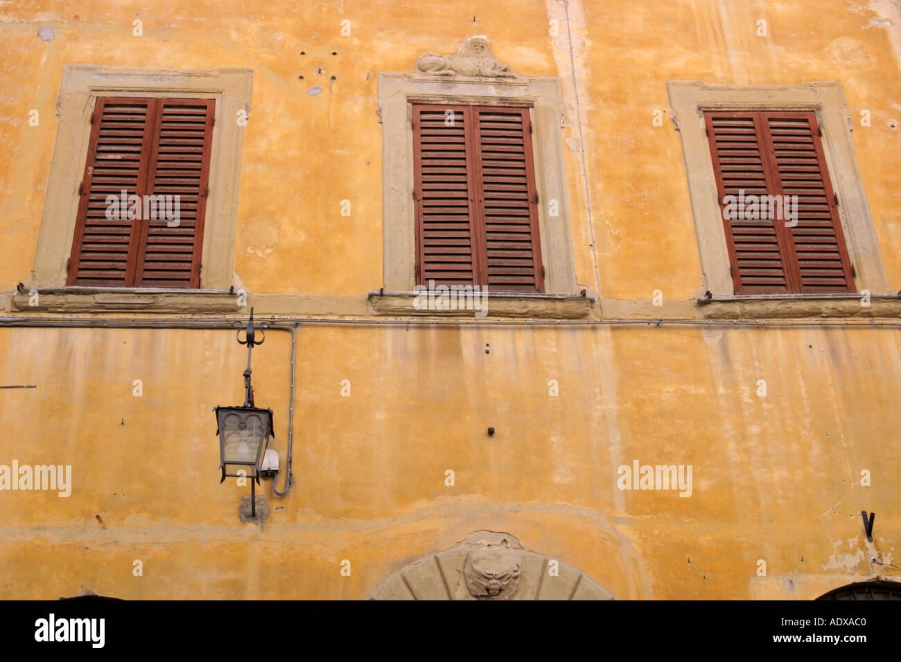 Typical window shutters and street lamp Arezzo Italy Stock Photo - Alamy
