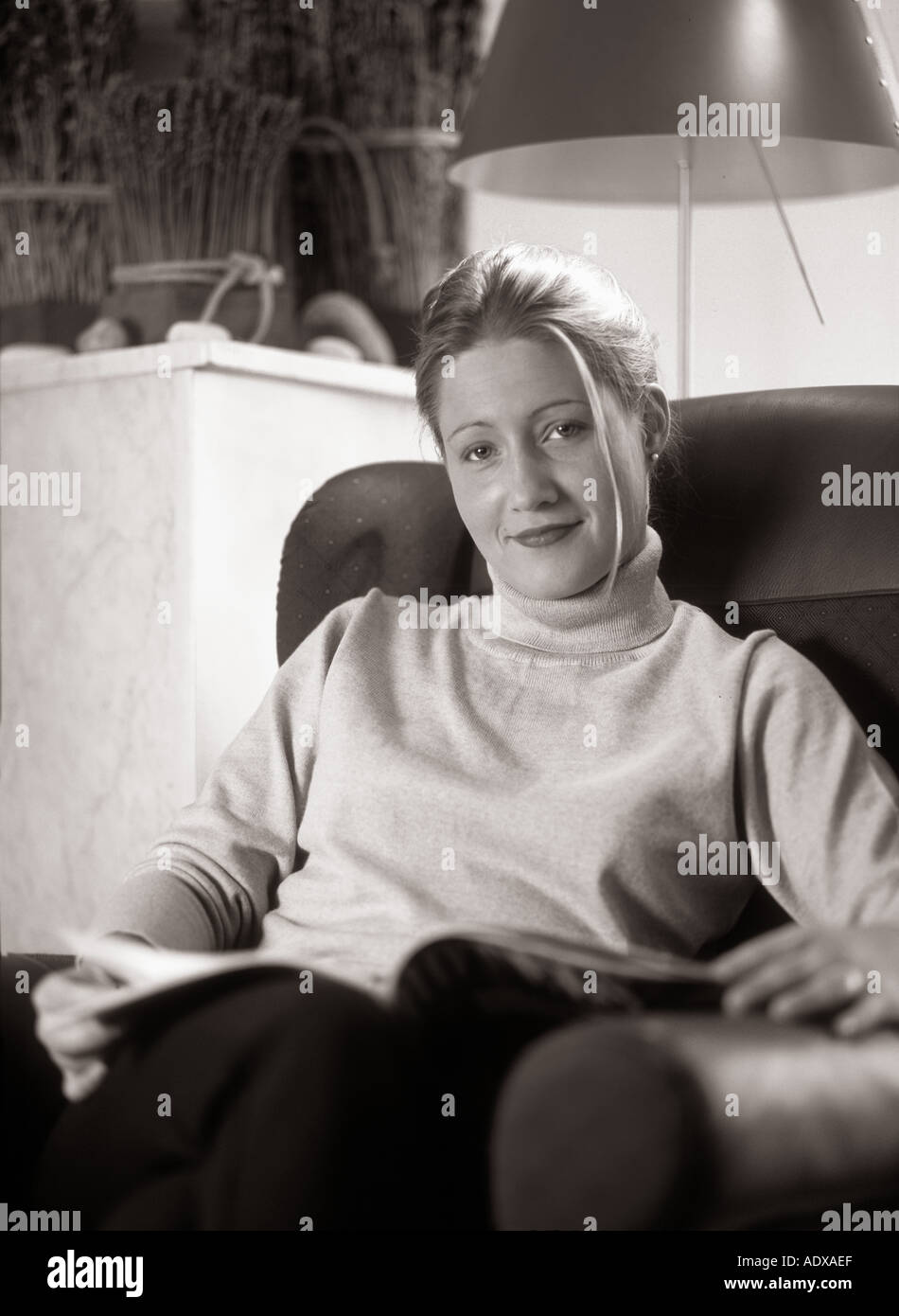 WOMAN READING MAGAZINE Stock Photo - Alamy