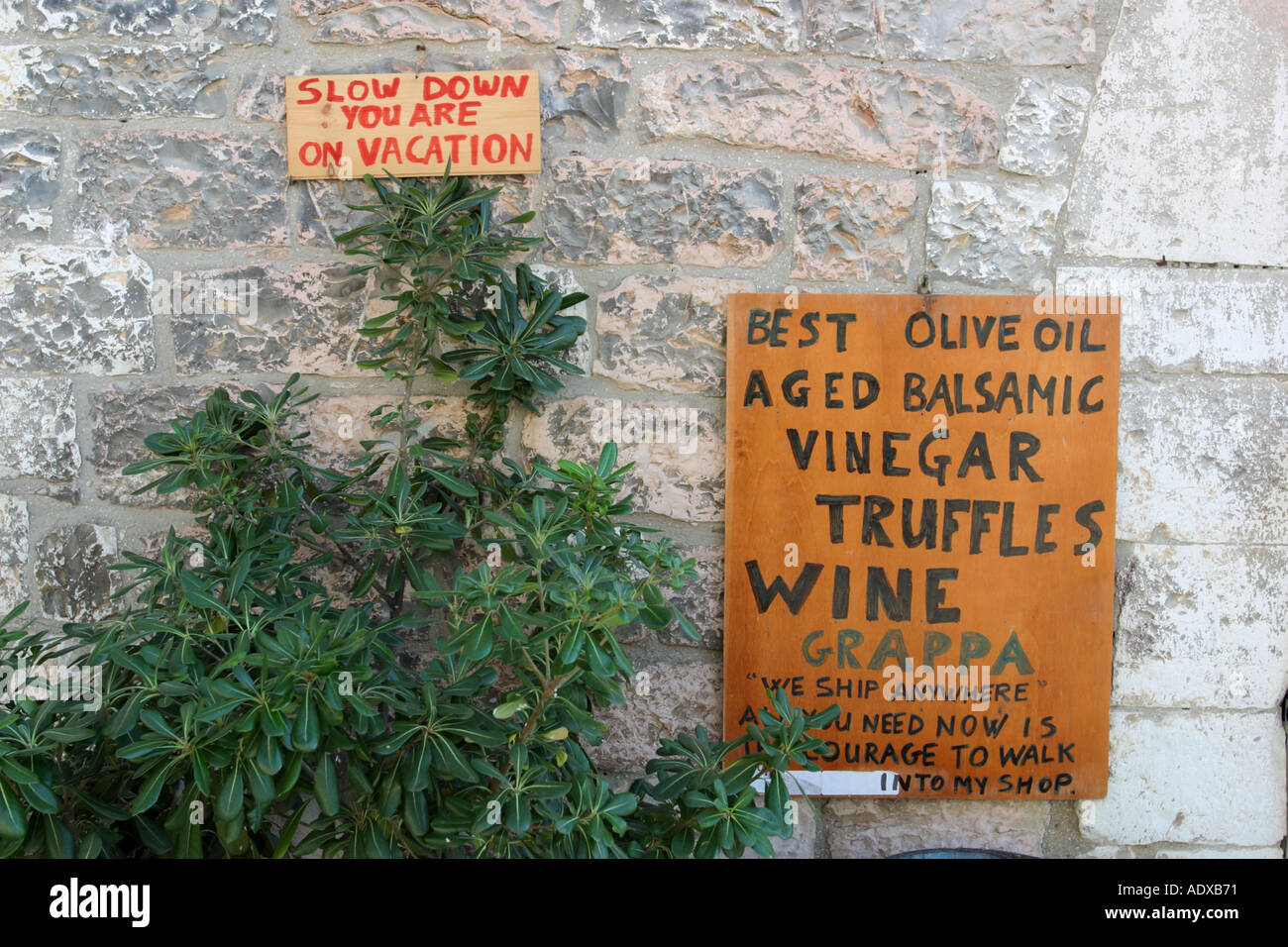 Signs on wall Assisi Italy Stock Photo - Alamy