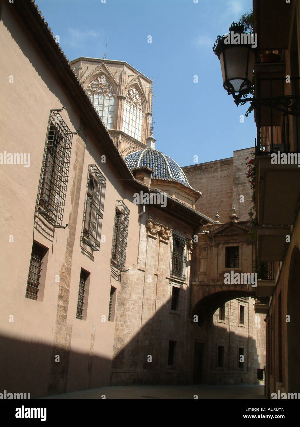 narrow street, Miguelete Tower and blue tile church roof, Old Town ...
