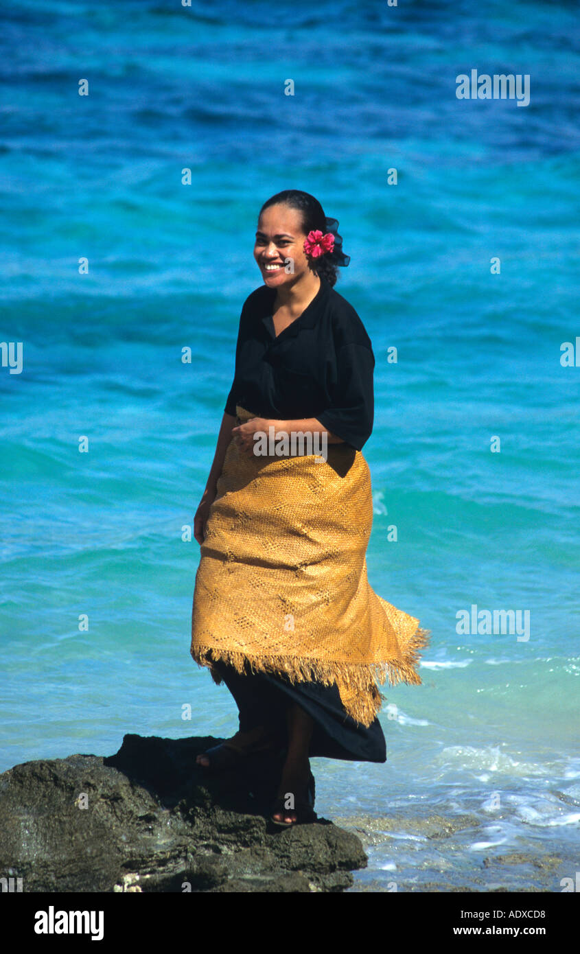 Smiling girl wears a traditional pandanus leave woven overskirt and ...