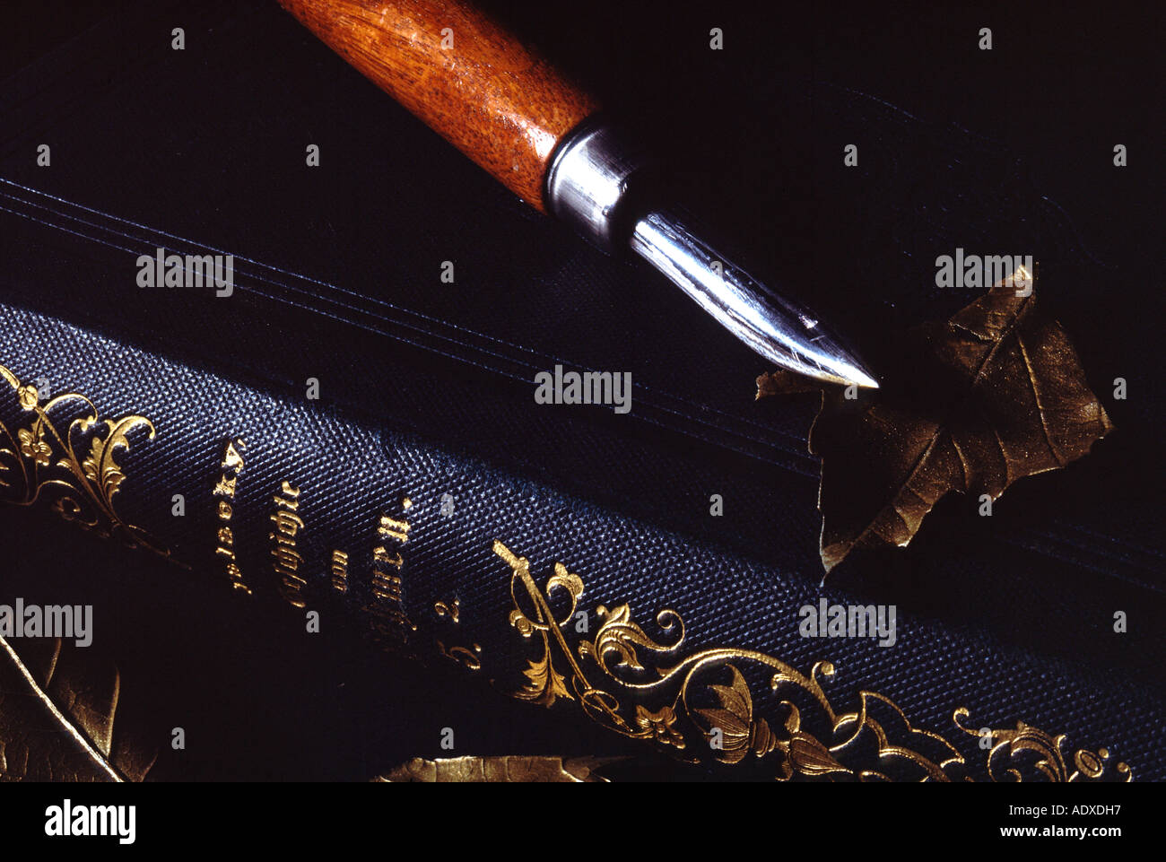 Gilding on antique book Stock Photo - Alamy
