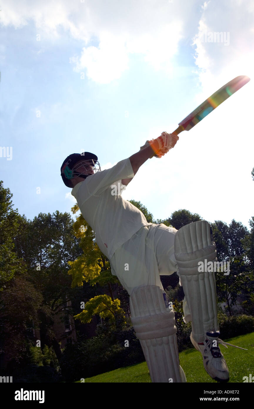 teenager playing cricket Stock Photo - Alamy