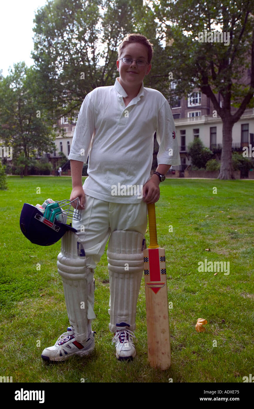 teenager playing cricket Stock Photo - Alamy