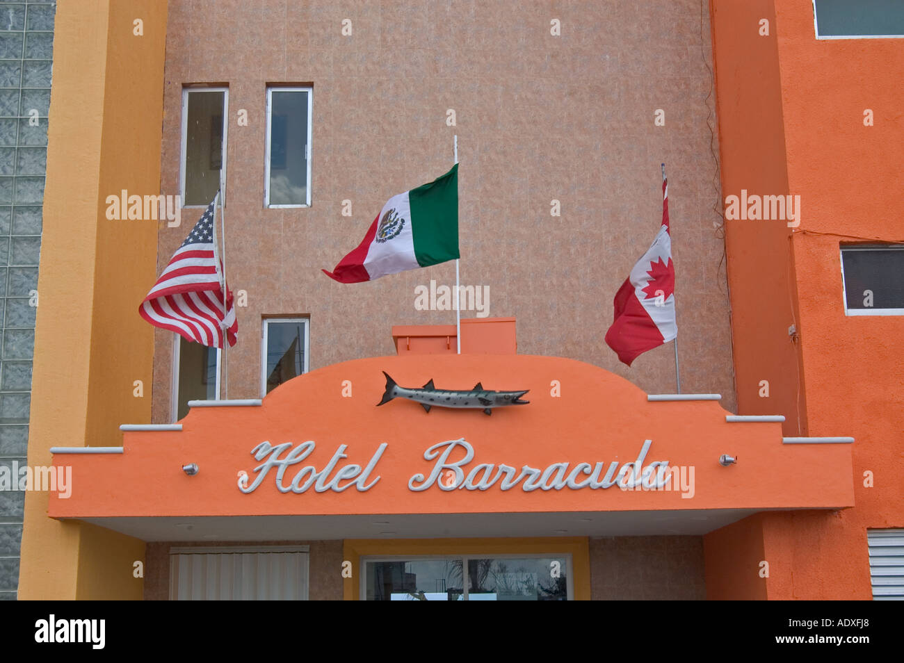 Entrance of Hotel Barracuda with three flags, San Miguel de Cozumel ...