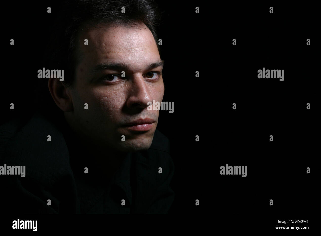 horizontal portrait of young man looking at the camera Stock Photo - Alamy