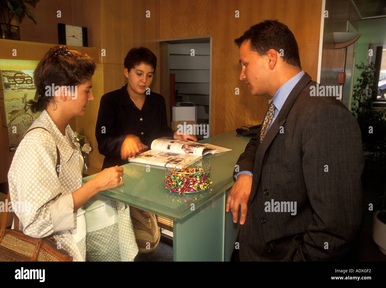 People employee concierge with guest at reception desk at hotel Paris ...