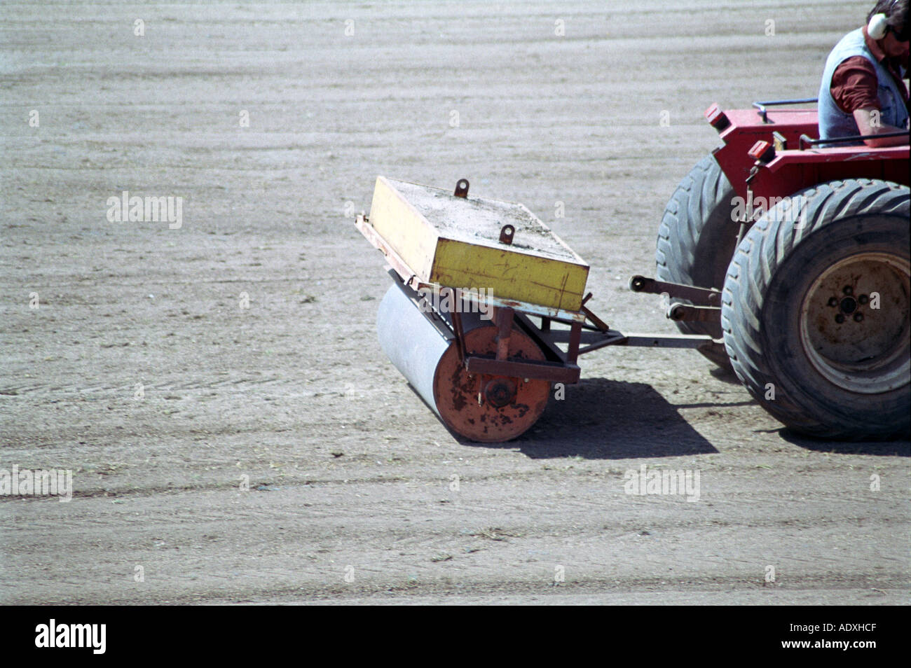 tractor flattening field Stock Photo - Alamy