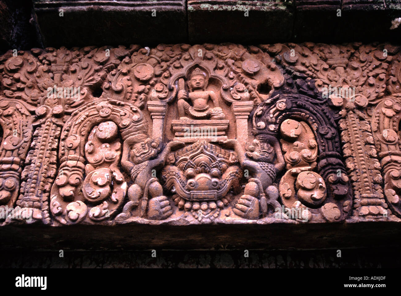 Elaborate carved stone lintel on a ruined temple at Wat Phou in ...